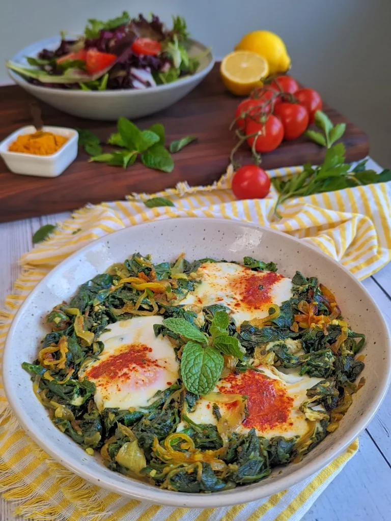 Nargesi – Spinach, Parsley and Mint Sauté with Poached Eggs by The Caspian Chef - FoodSocial