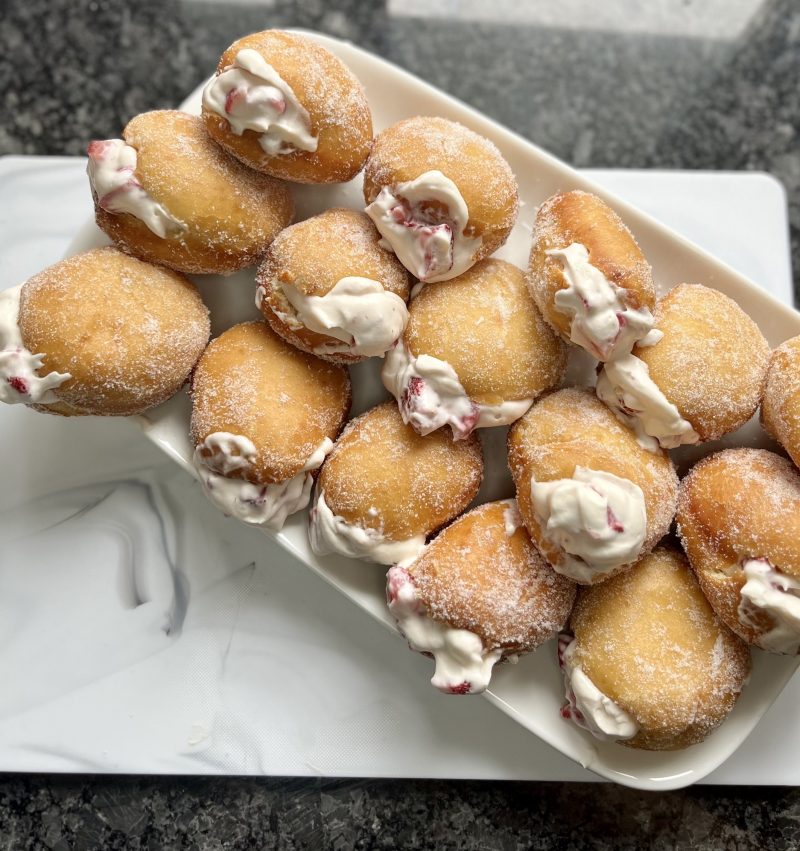 Strawberries and Cream Bomboloni by The Sweetheart District - FoodSocial